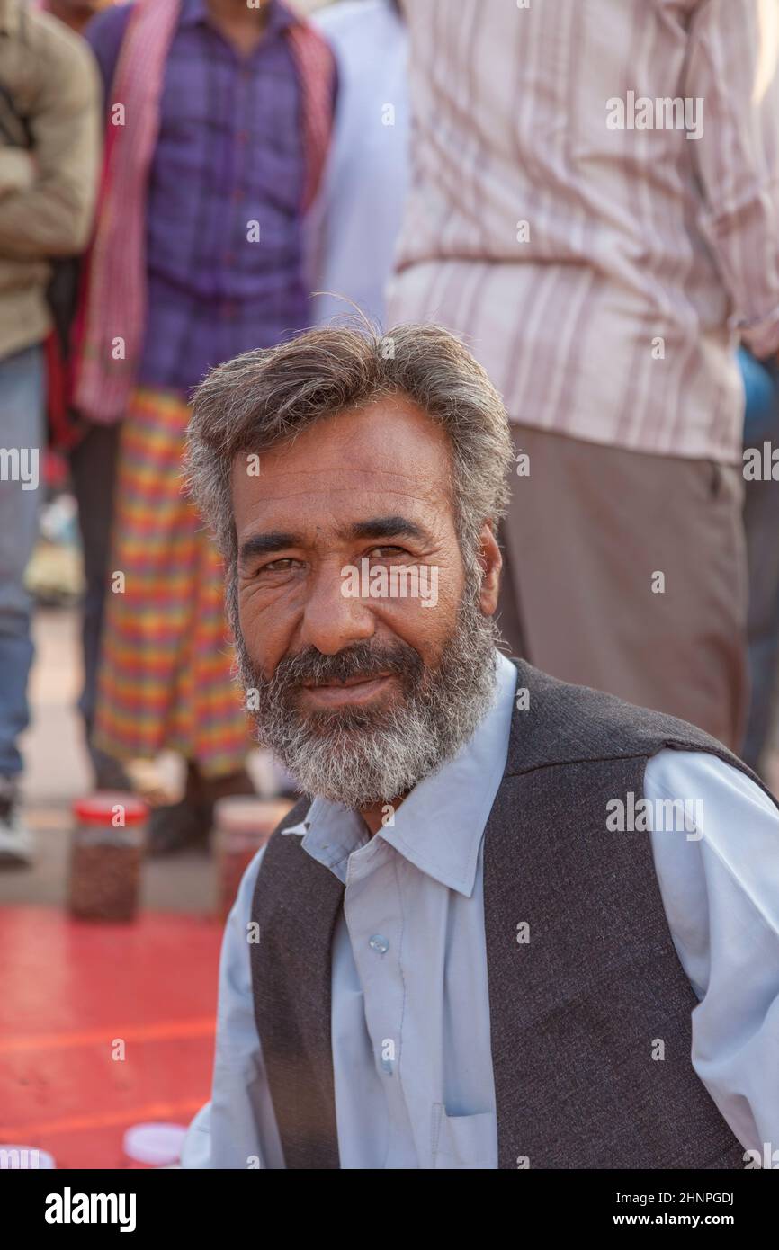 portrait of male hawker selling their goods at Meena Bazaar Market in ...