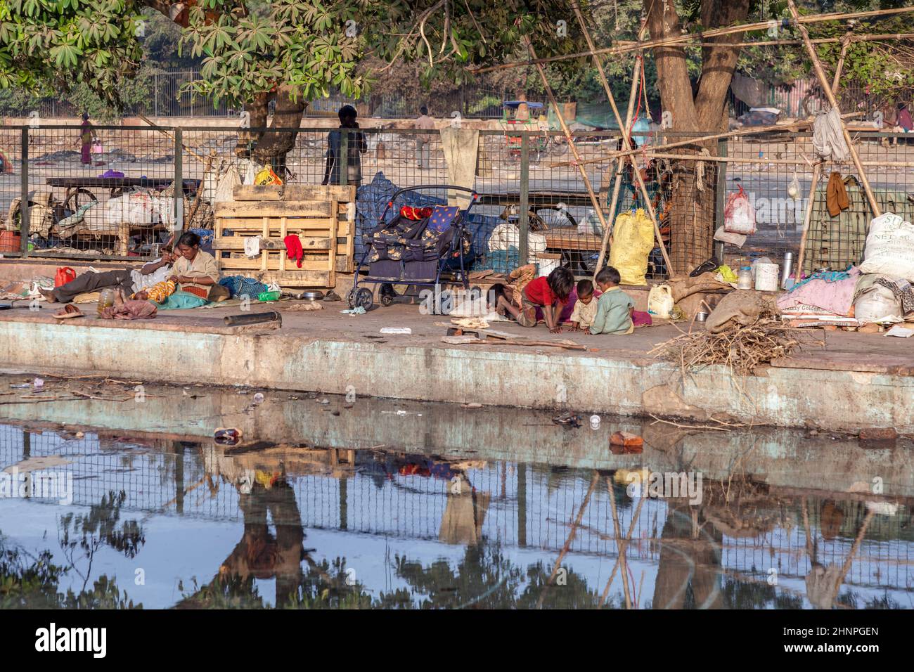 poor people live at the promenade of a canal near Meena Bazaar Market ...