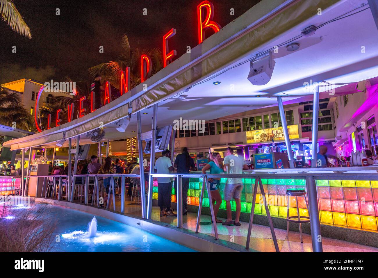 people enjoy nightlife at Ocean Drive along South Beach Miami in the ...