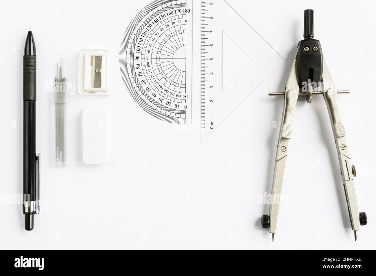 Set of measuring tools with compass, pencil and rulers on white ...