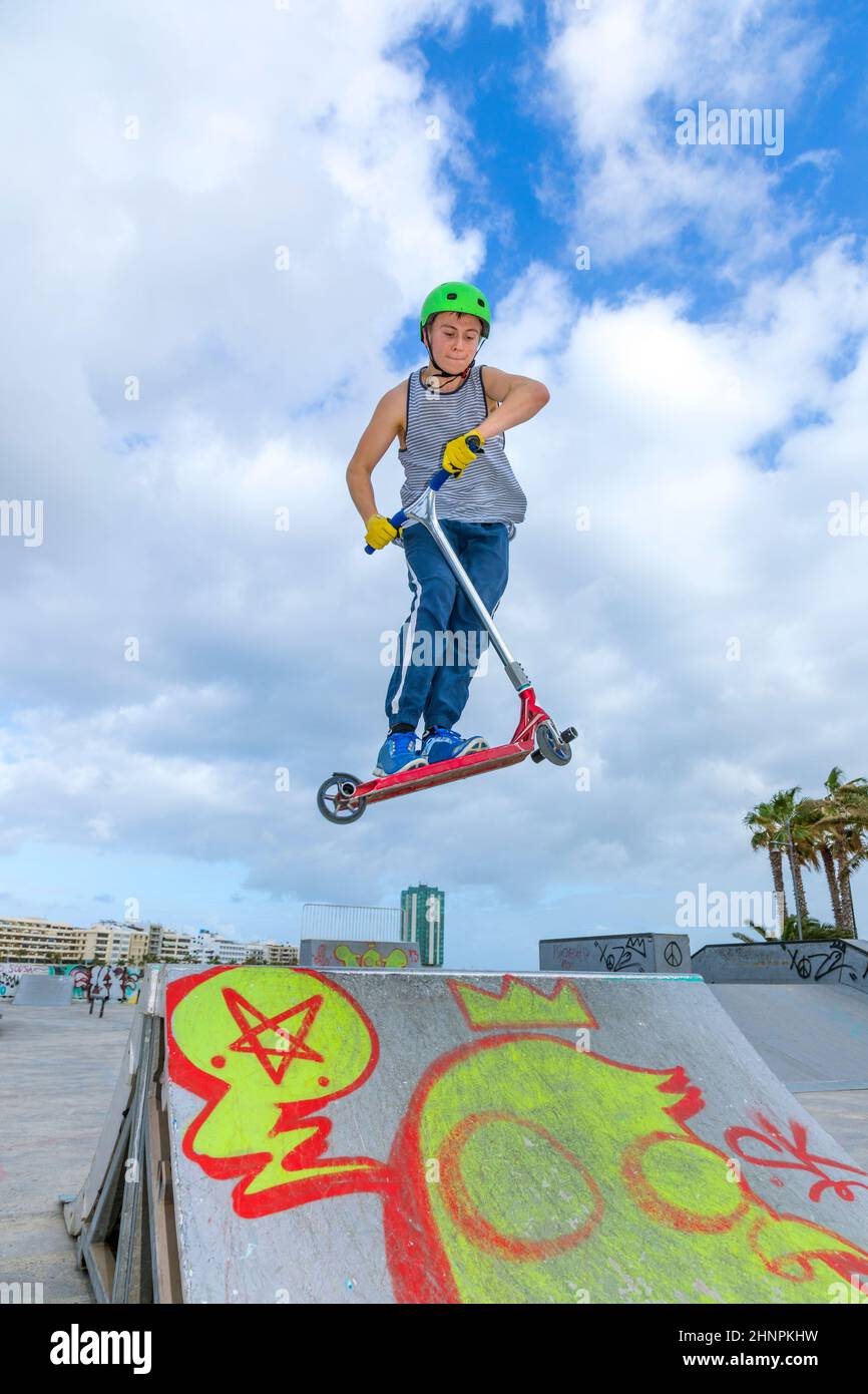 boy jumping at the skate park over a ramp Stock Photo - Alamy