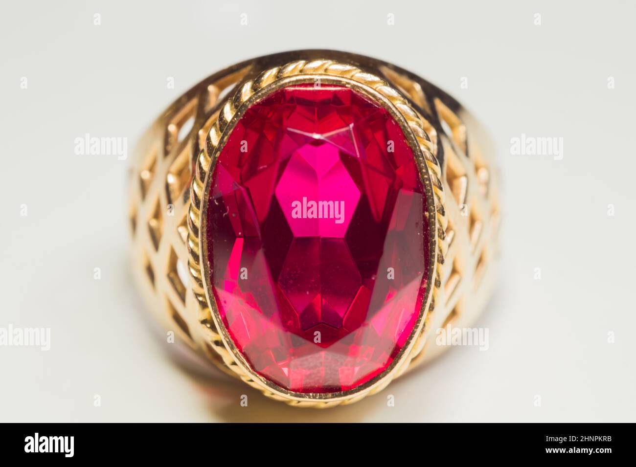 Golden ring with ruby isolated on white background Stock Photo - Alamy