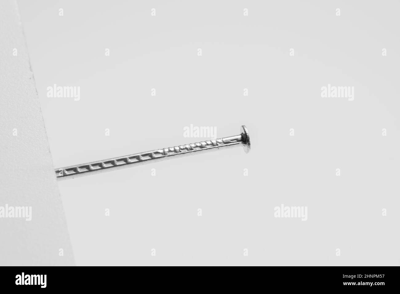 Metal nail isolated on white Stock Photo - Alamy