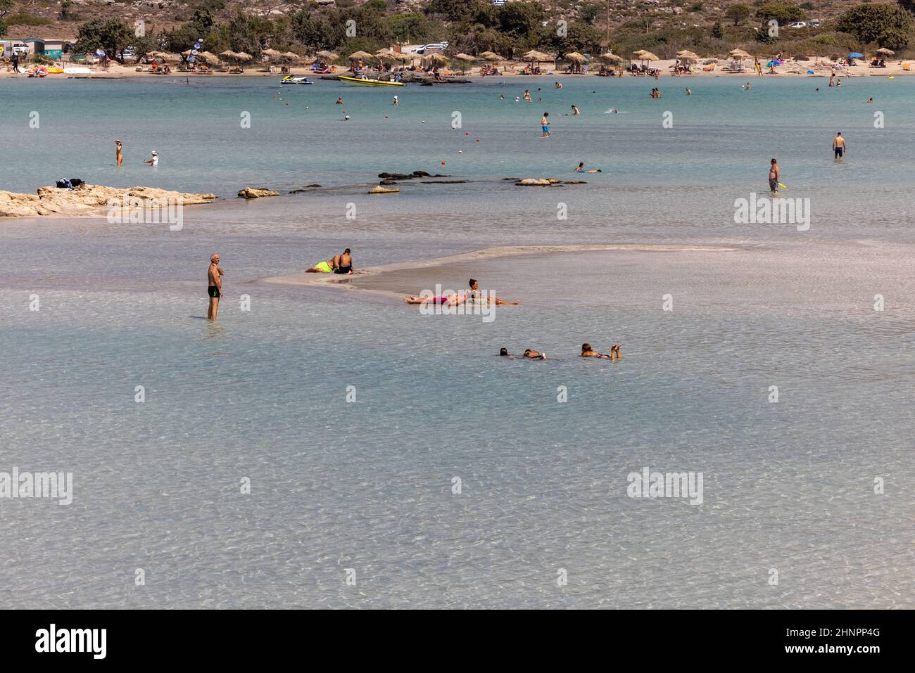 People relaxing on the famous pink coral beach of Elafonisi on Crete ...