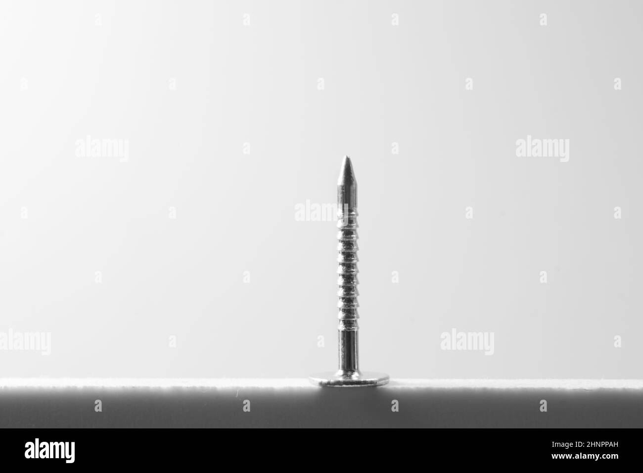 Metal nail isolated on white background Stock Photo - Alamy