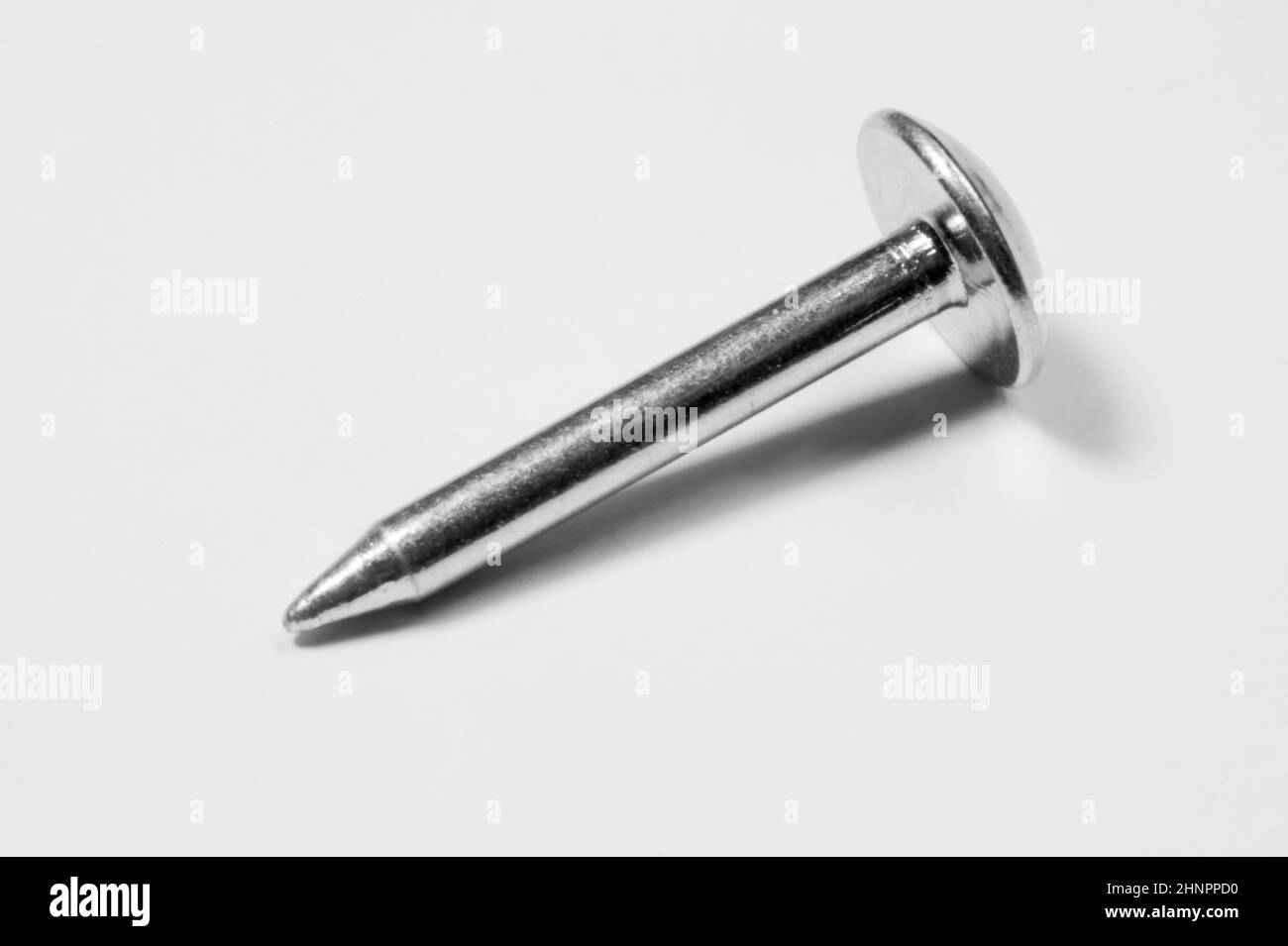 Metal nail isolated on white Stock Photo - Alamy