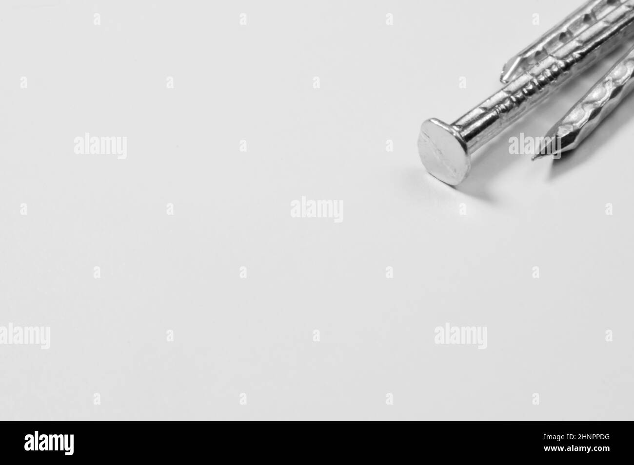 Metal nails isolated on white background Stock Photo - Alamy