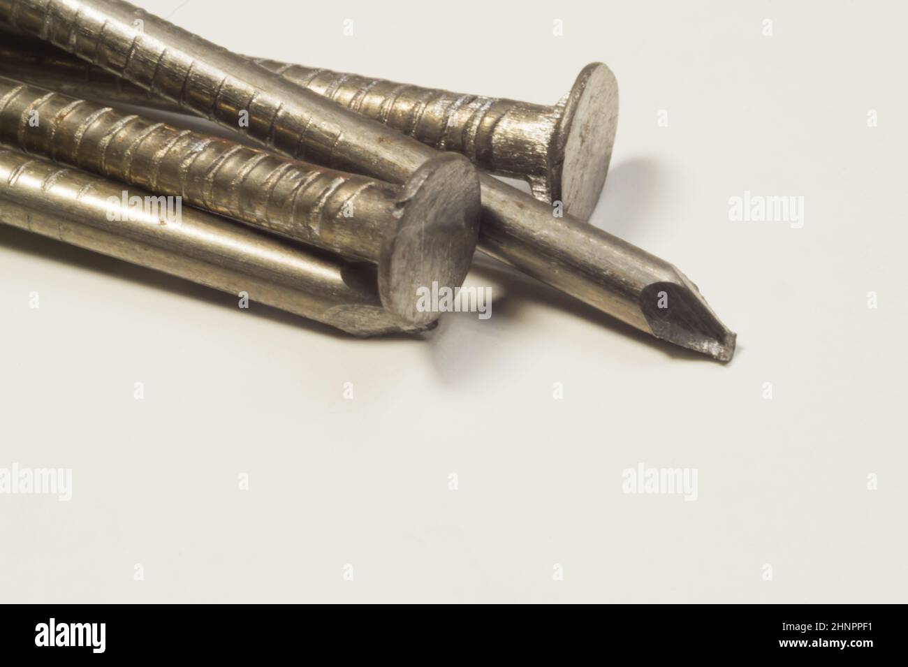 Metal nails isolated on white background Stock Photo - Alamy