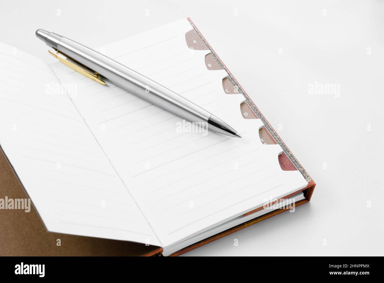 Open notepad with ballpoint with plenty of copyspace Stock Photo - Alamy