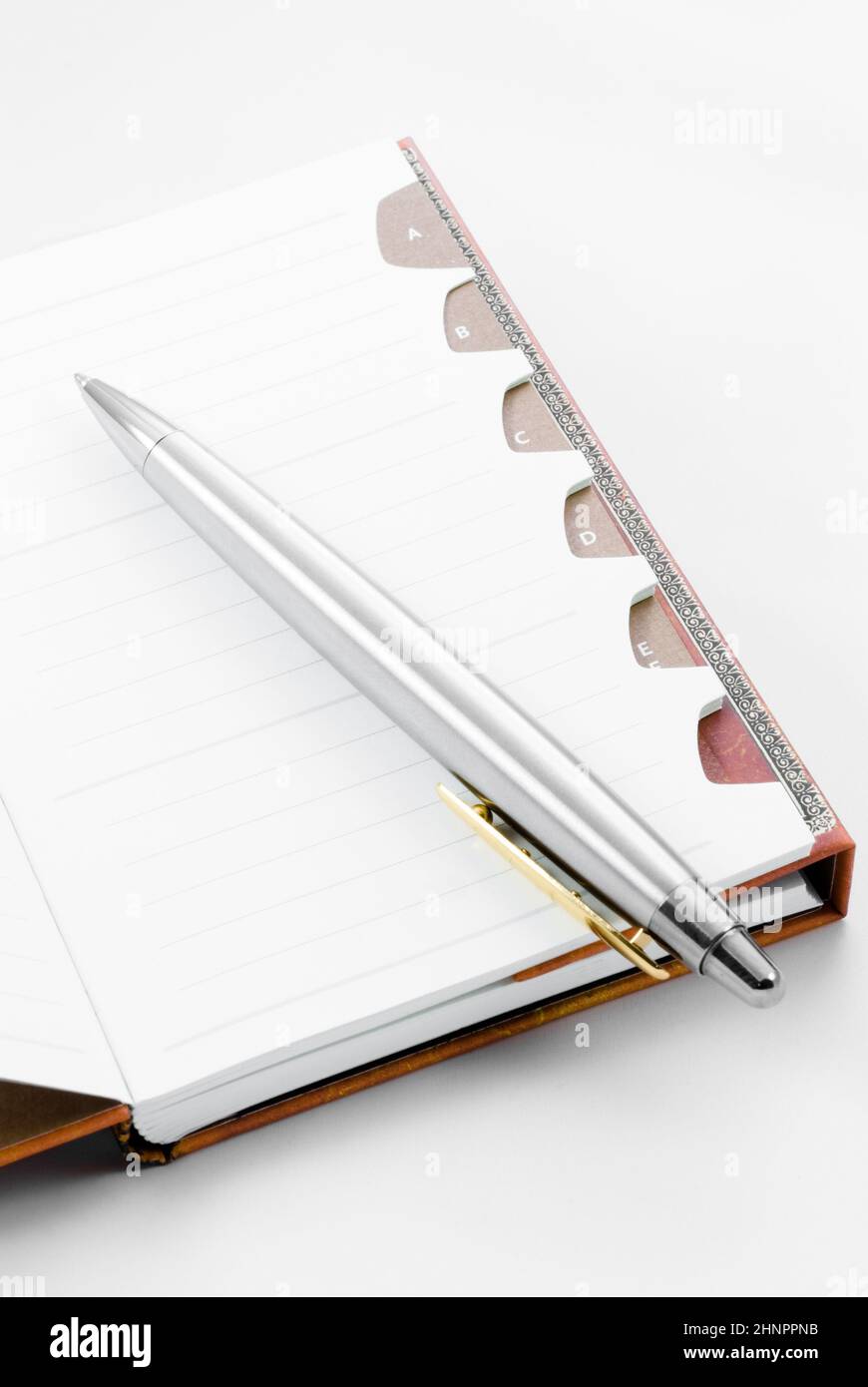 Open notepad with ballpoint with plenty of copyspace Stock Photo - Alamy