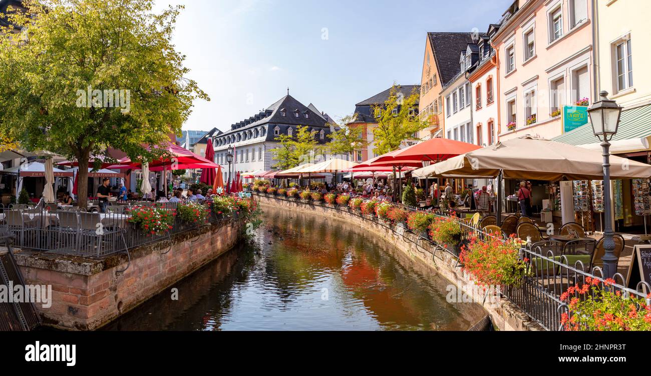 city center of Saarburg with creek and restaurants at the promenade ...