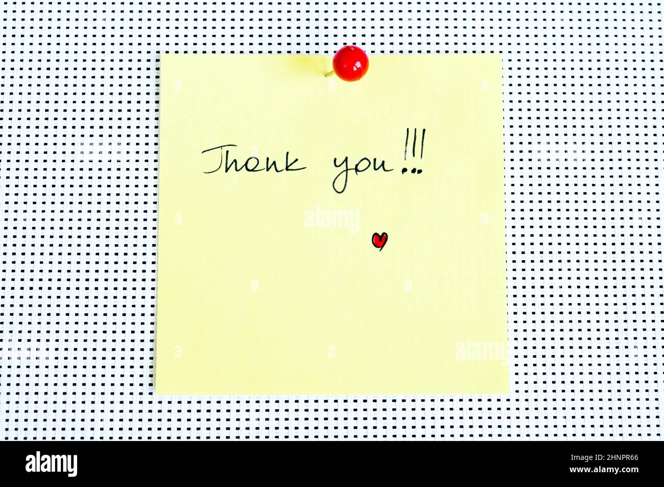 Postit note saying Thank You arranged on black and white background ...