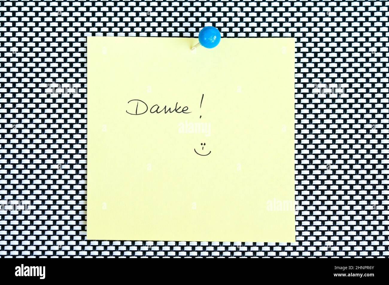 Postit note saying Danke arranged on black and white background Stock ...