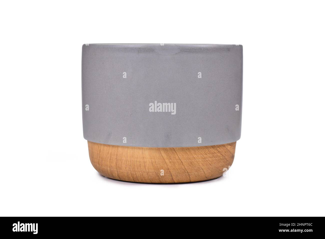 Empty flower pot made from gray ceramic with wooden bottom on white ...