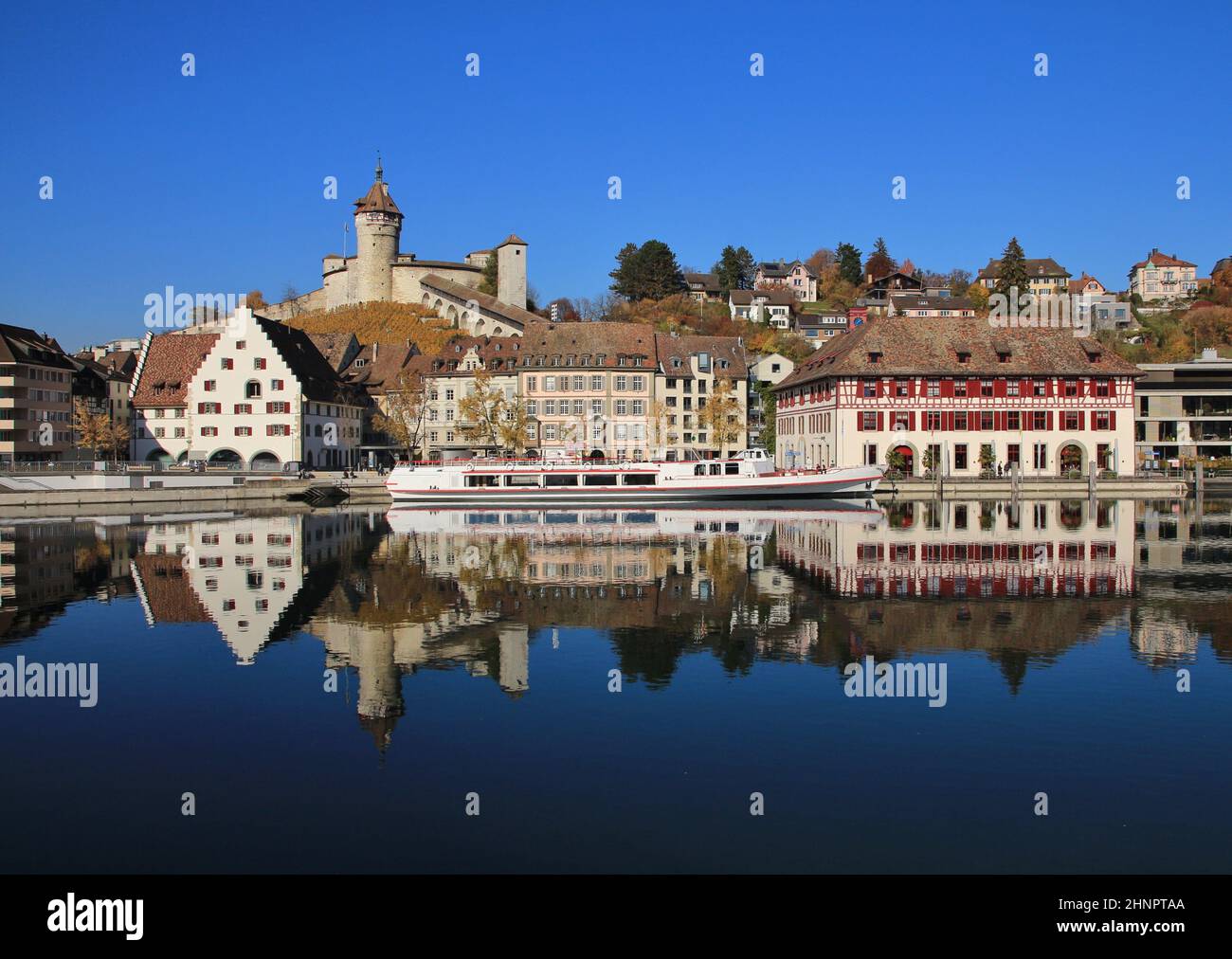Medieval castle Munot and old houses reflecting in the river Rhine ...