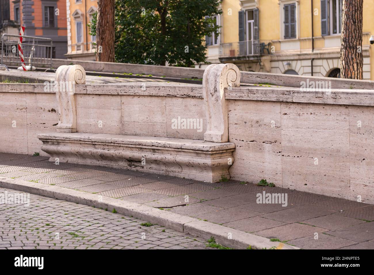 A bench on the street of Rome. An old stone bench in one of the squares ...