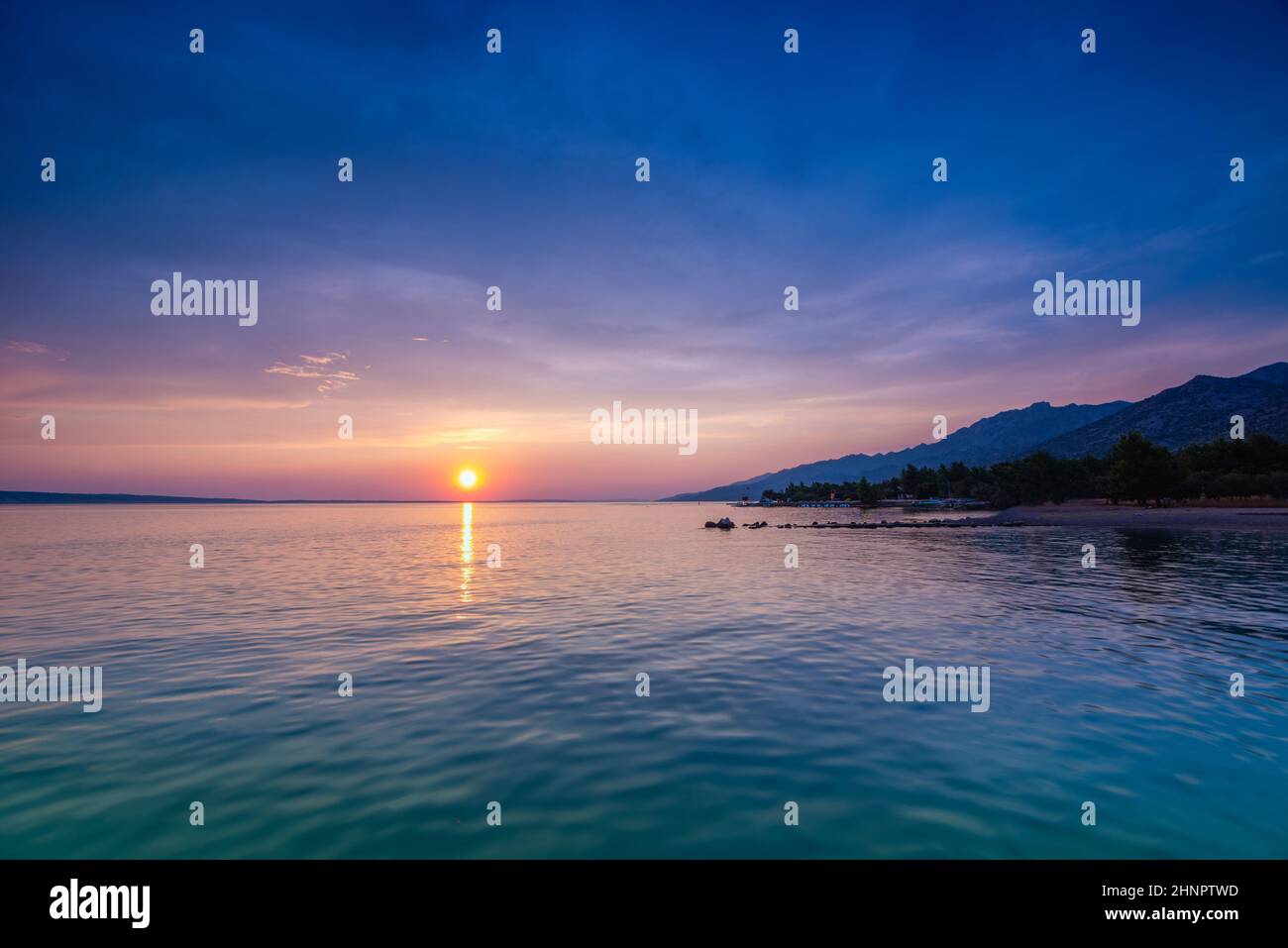 Sunset over Adriatic Sea with colourful dramatic sky near Starigrad in ...