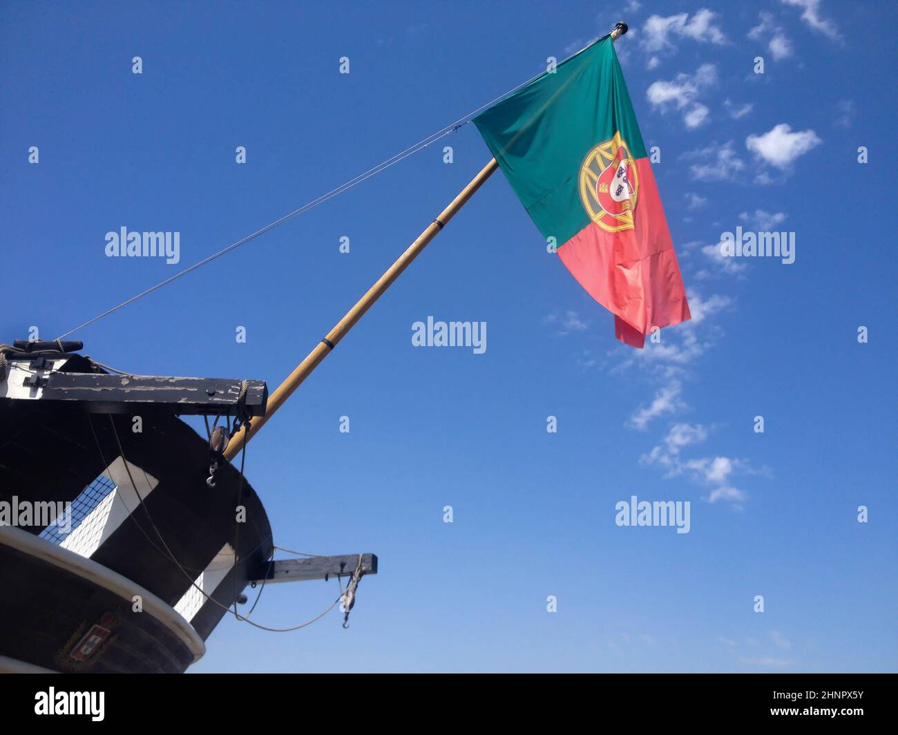 Portugal flag against blue sky background Stock Photo - Alamy