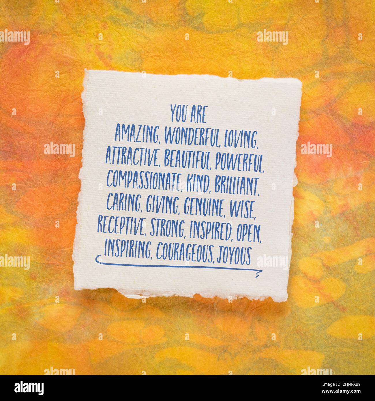 positive affirmation with a long list of words - handwriting on a small ...