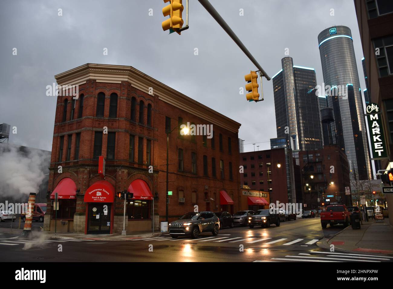 Traditional buildings and steam vents in front of the General Motors HQ ...