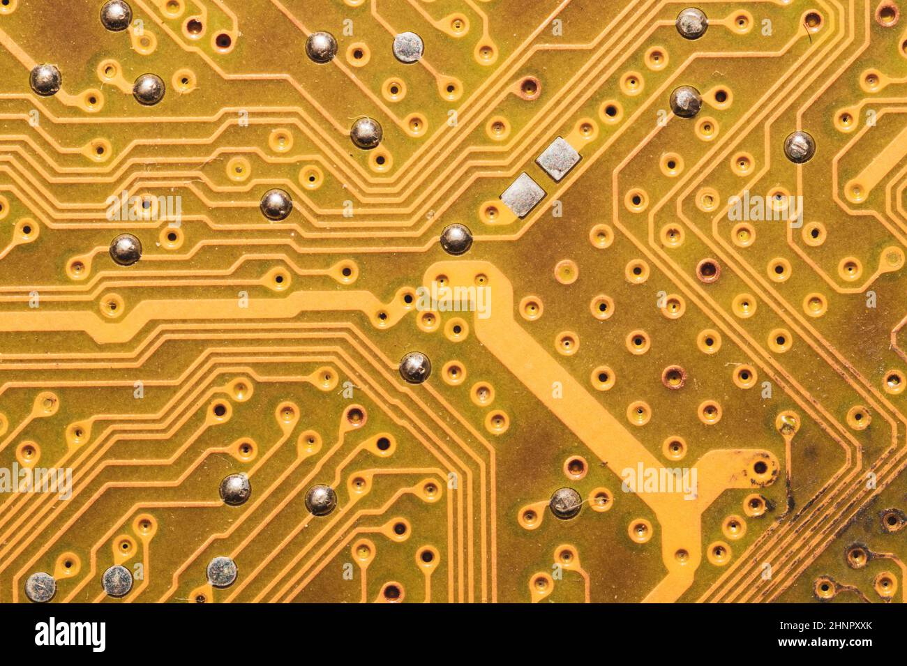 Burnt circuit board abstract background. spoiled motherboard close up ...