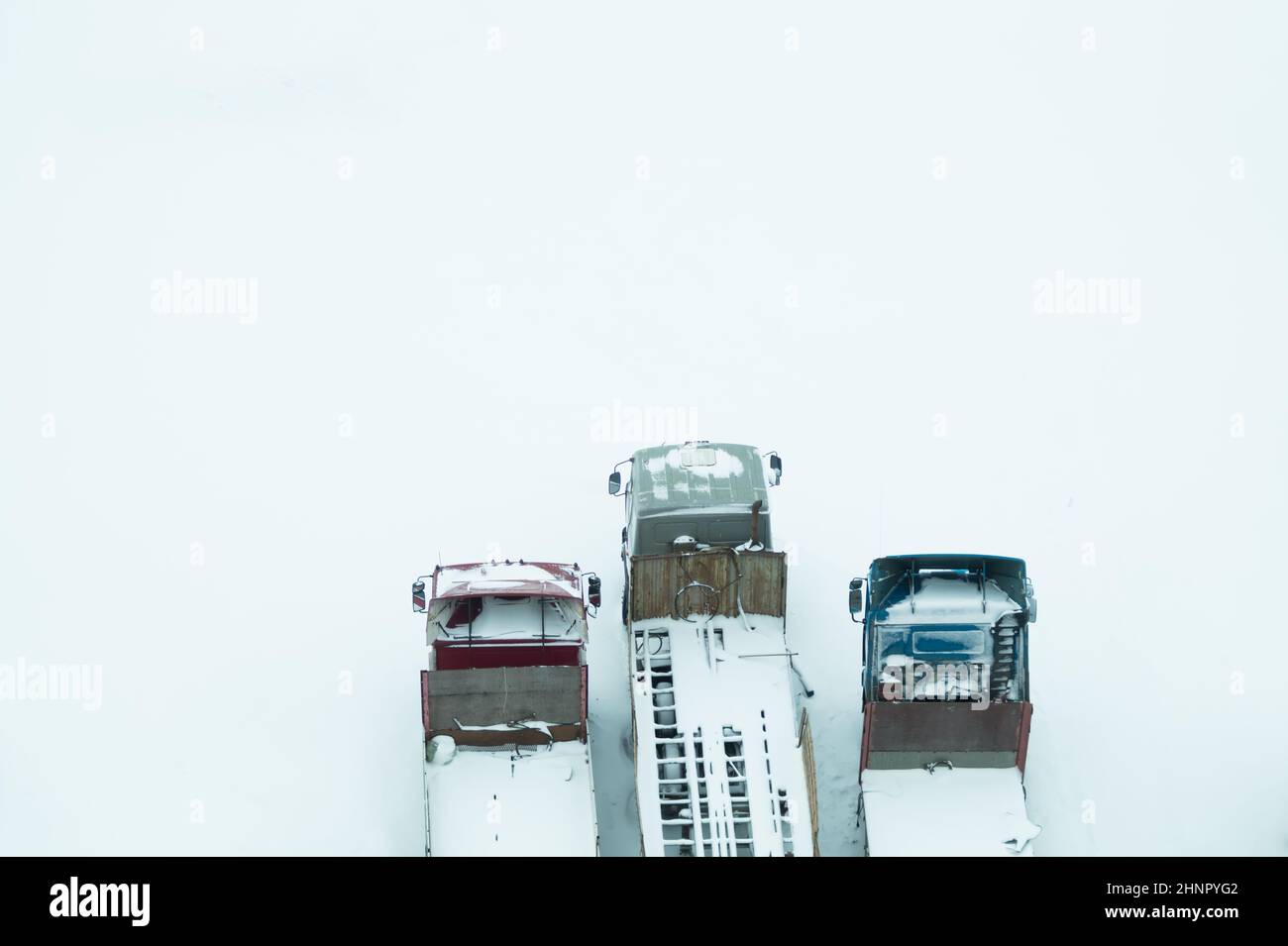 Truck under the snow. lorry covered with snow after snowfall. long ...