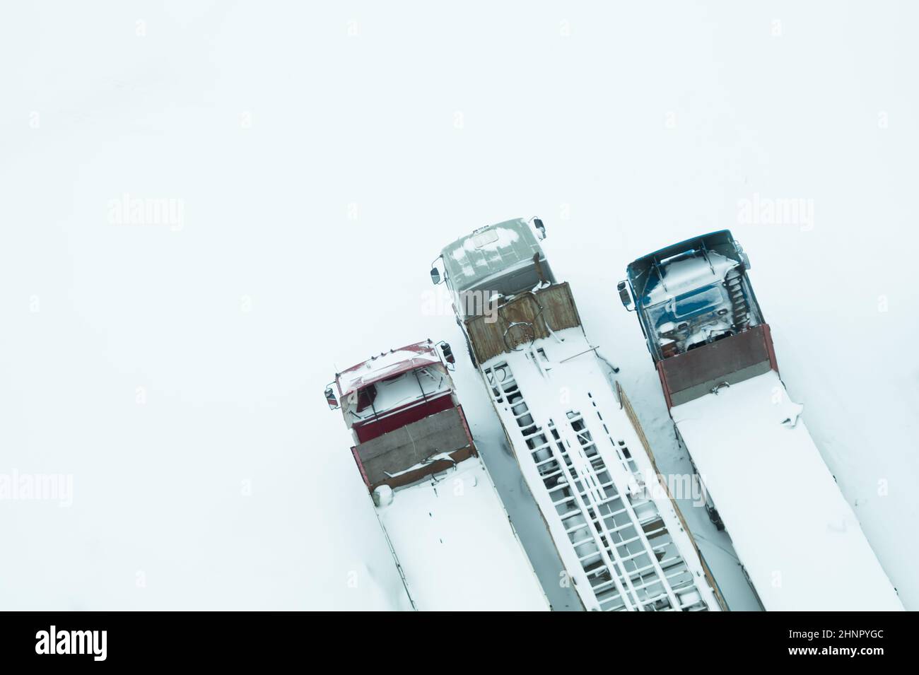 Truck under the snow. lorry covered with snow after snowfall. long ...
