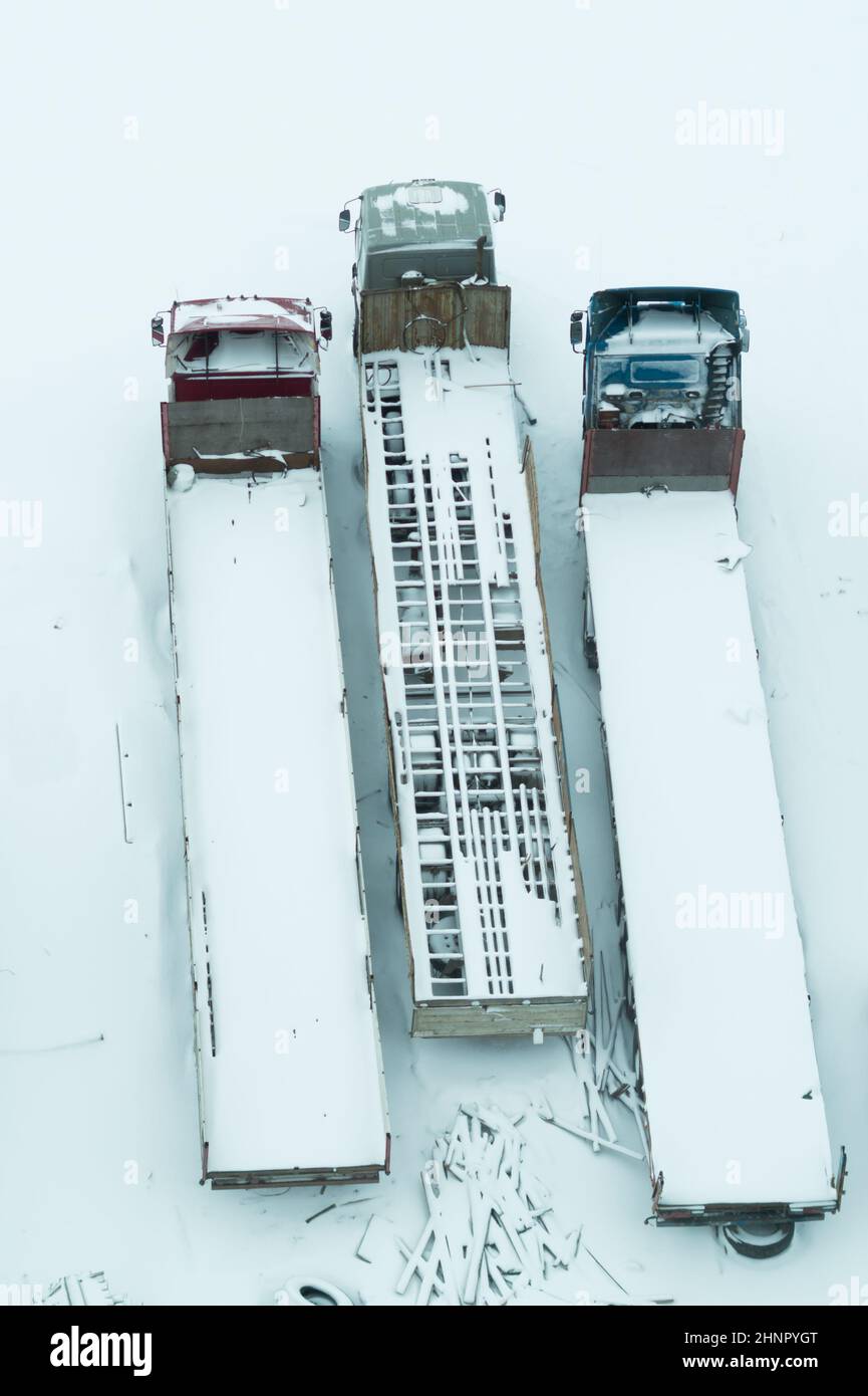 Truck under the snow. lorry covered with snow after snowfall. long ...