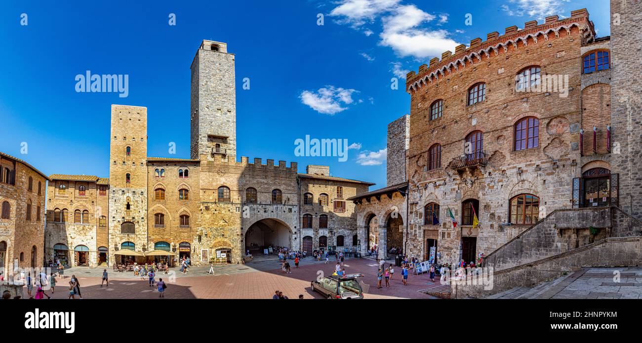 Old medeival square and towers in typical Tuscan town San Gimignano ...