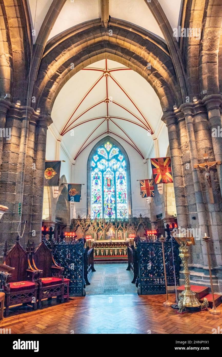 Altar with stained glass panel depicting various biblical figures ...