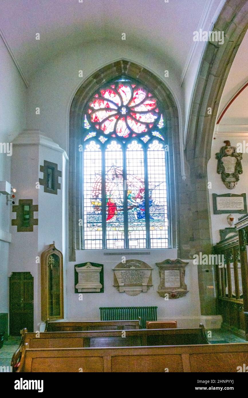Altar with stained glass panel depicting various biblical figures ...
