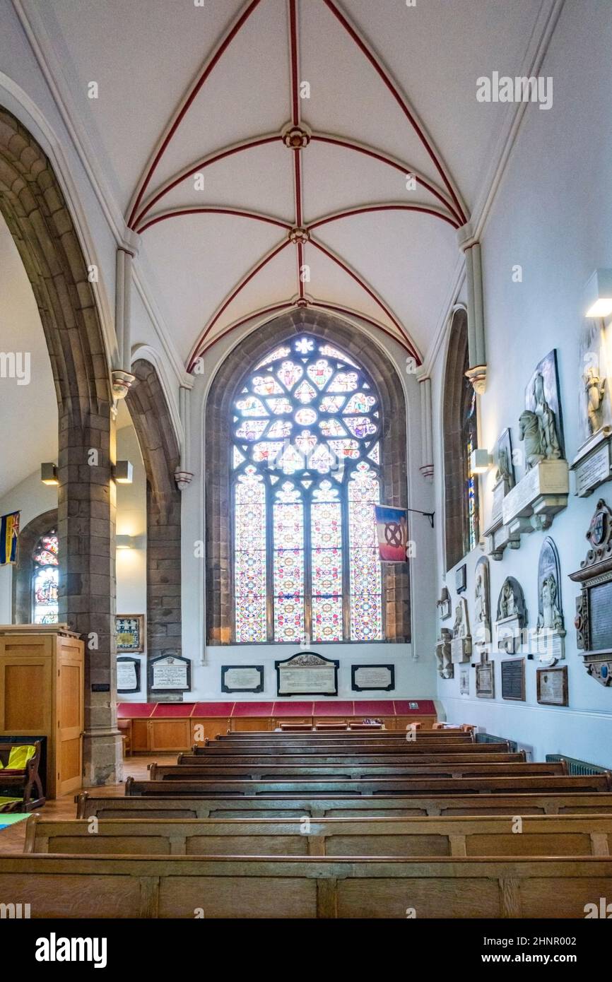 Altar with stained glass panel depicting various biblical figures ...