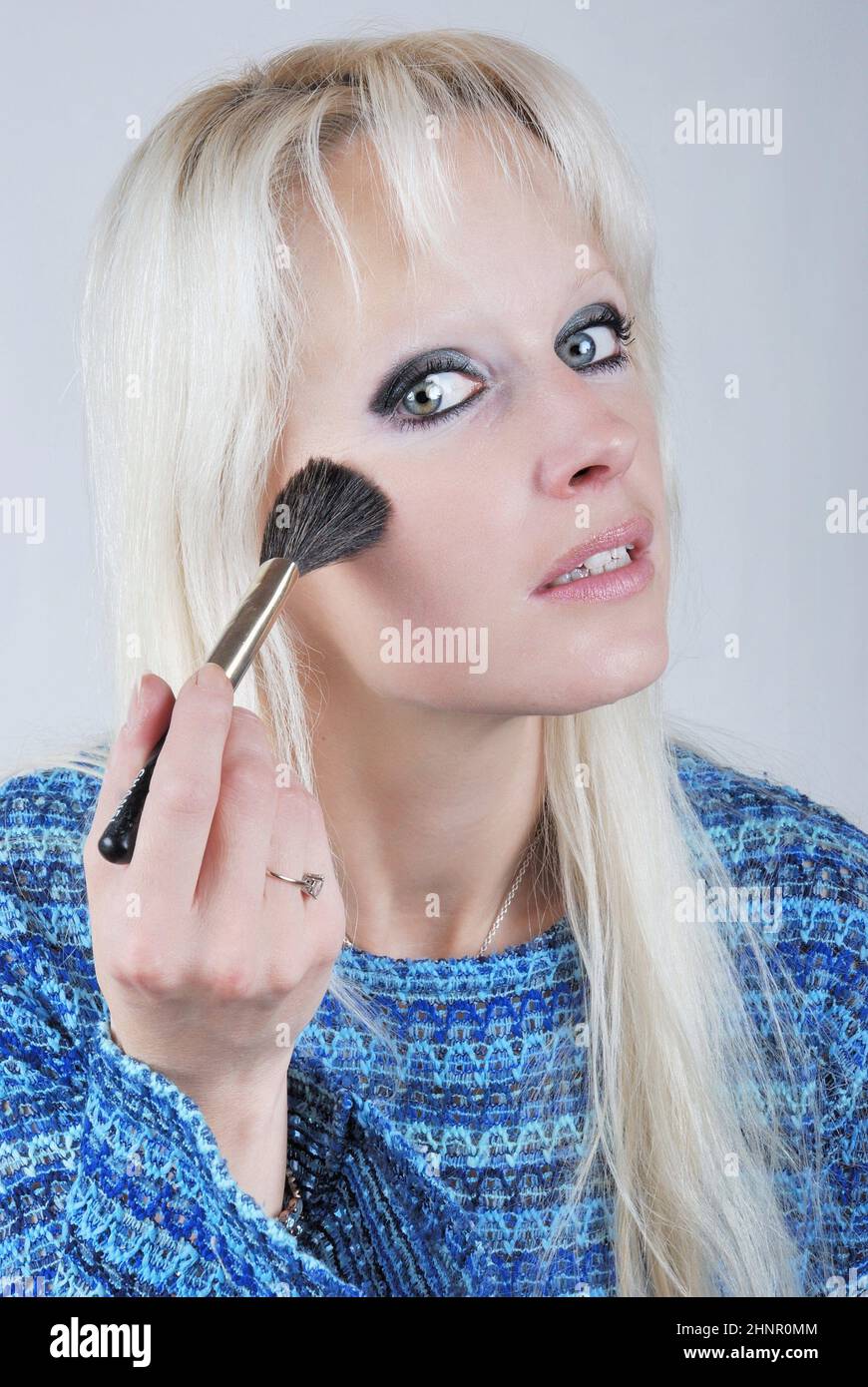 Applying makeup hi-res stock photography and images - Alamy