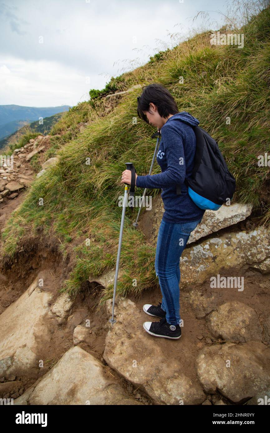 Girl Descend Down a Large Green Mountain Range Stock Photo - Alamy