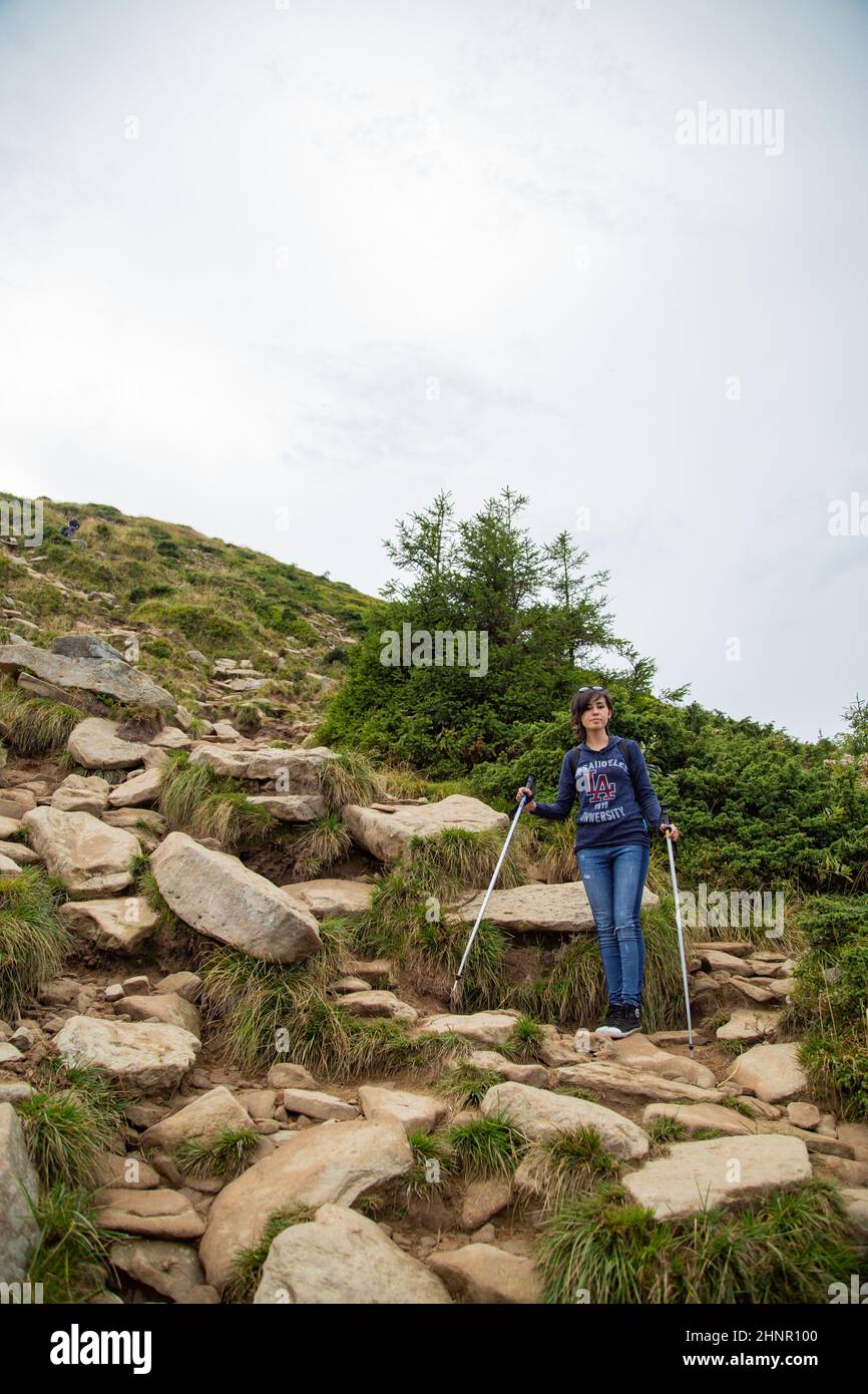 Girl Descend Down a Large Green Mountain Range Stock Photo - Alamy
