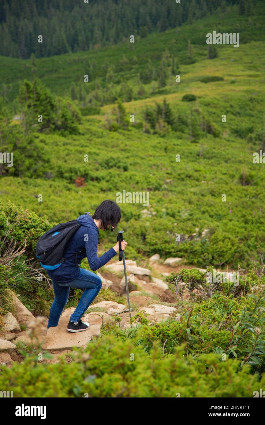 Girl Descend Down a Large Green Mountain Range Stock Photo - Alamy