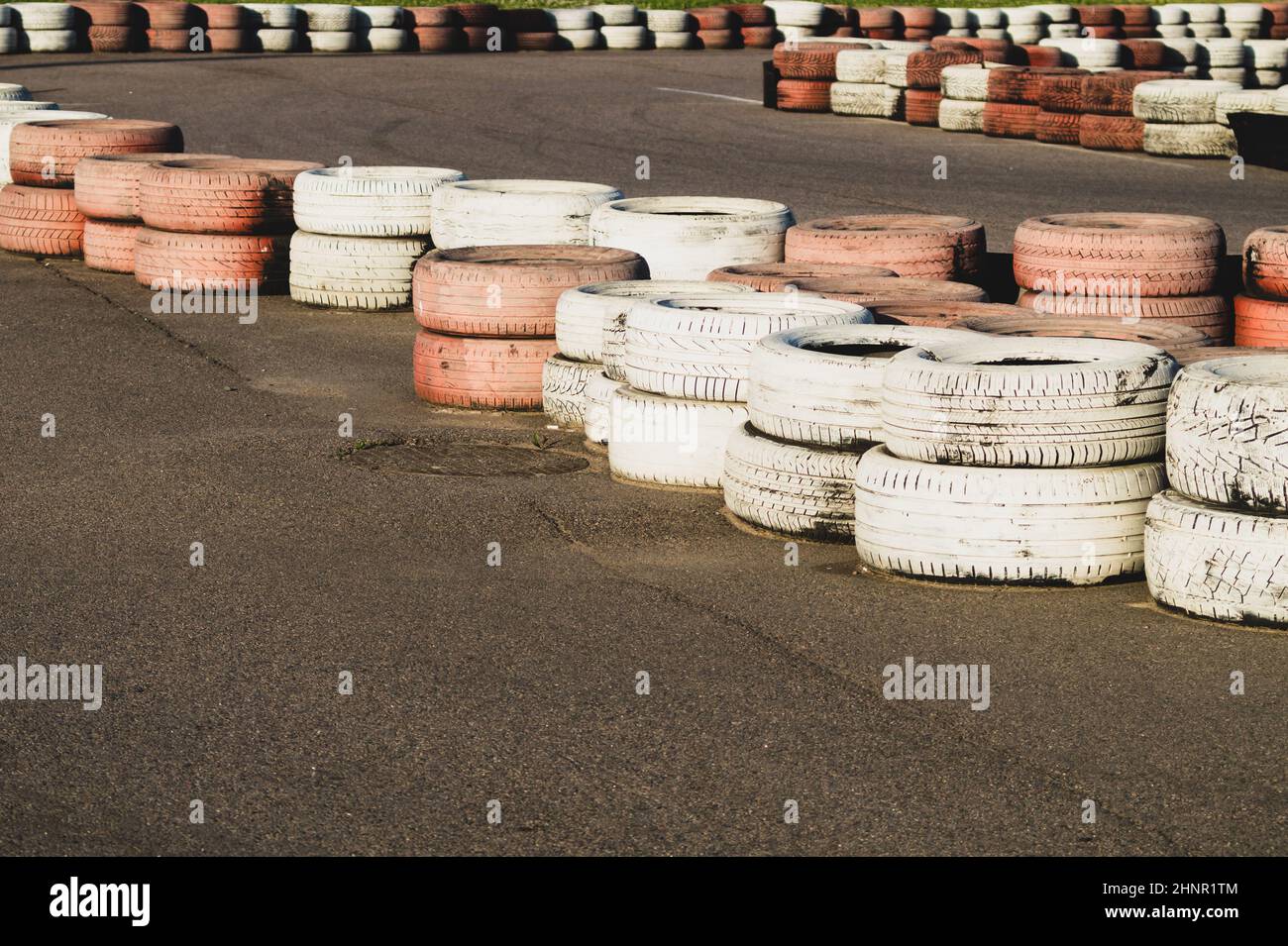 Race track safety barrier. asphalt racing track with red and white ...
