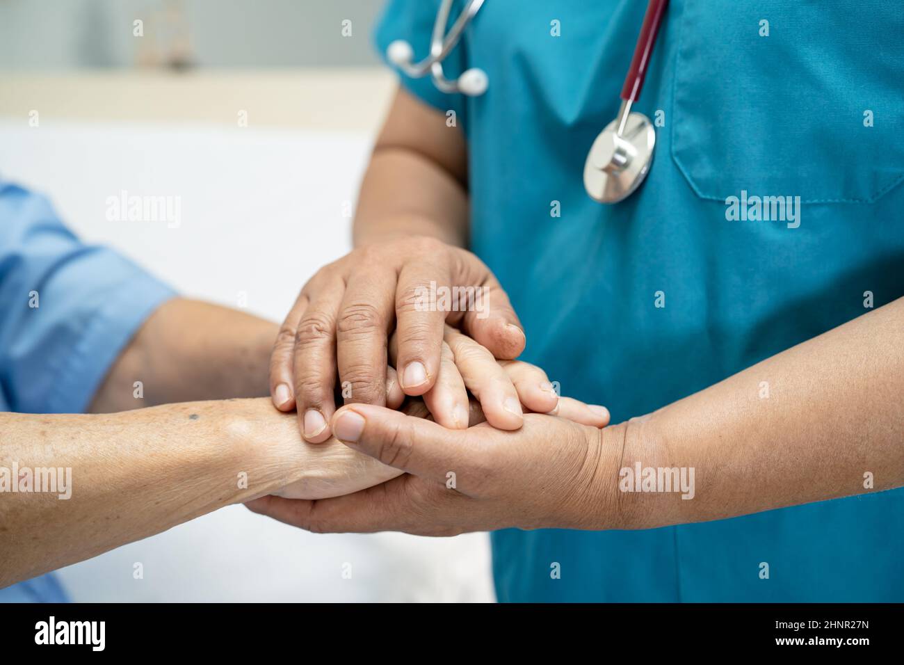 Holding hands Asian senior or elderly old lady woman patient with love ...