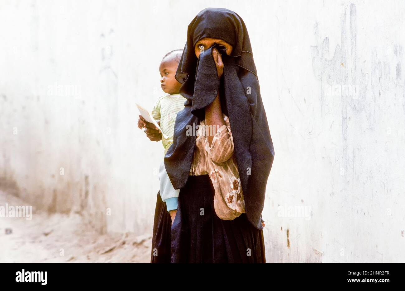 arabic unknown mother carries her baby in a wraparound garment Stock ...