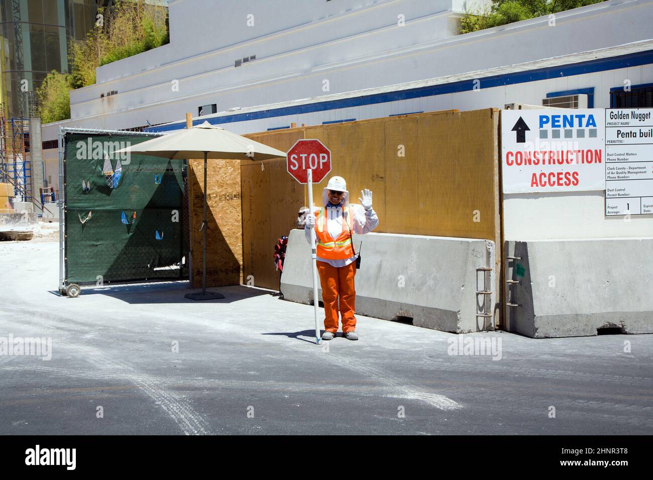 Woman assecurity guard is regulating the access Stock Photo - Alamy