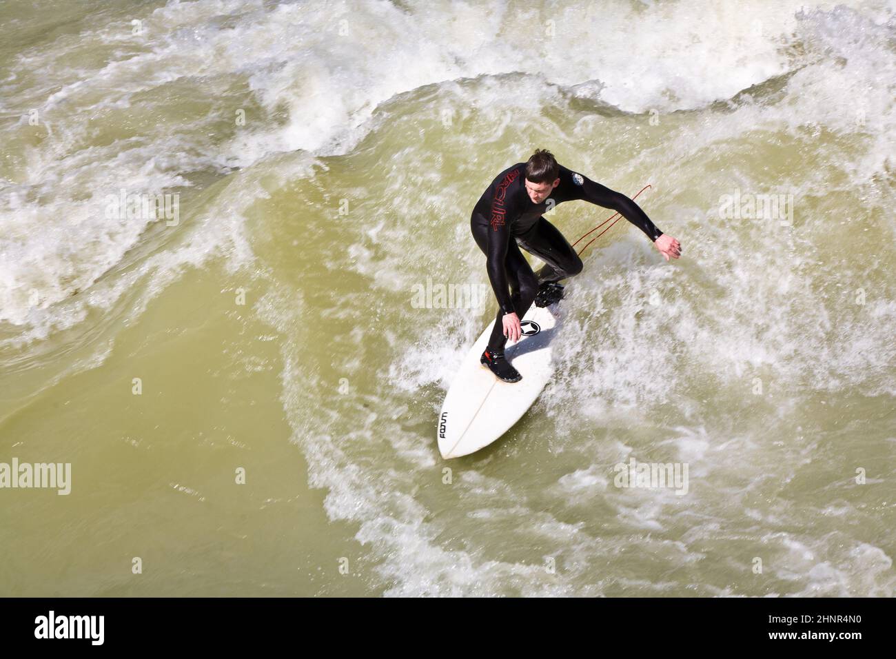 surfer surfs at the Isar in huge waves Stock Photo - Alamy