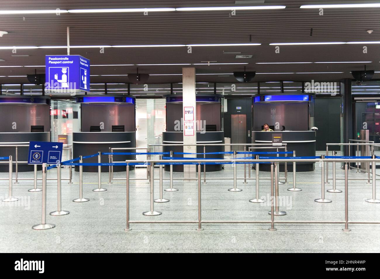 Officer is waiting at Passport Control counter for arriving passengers ...