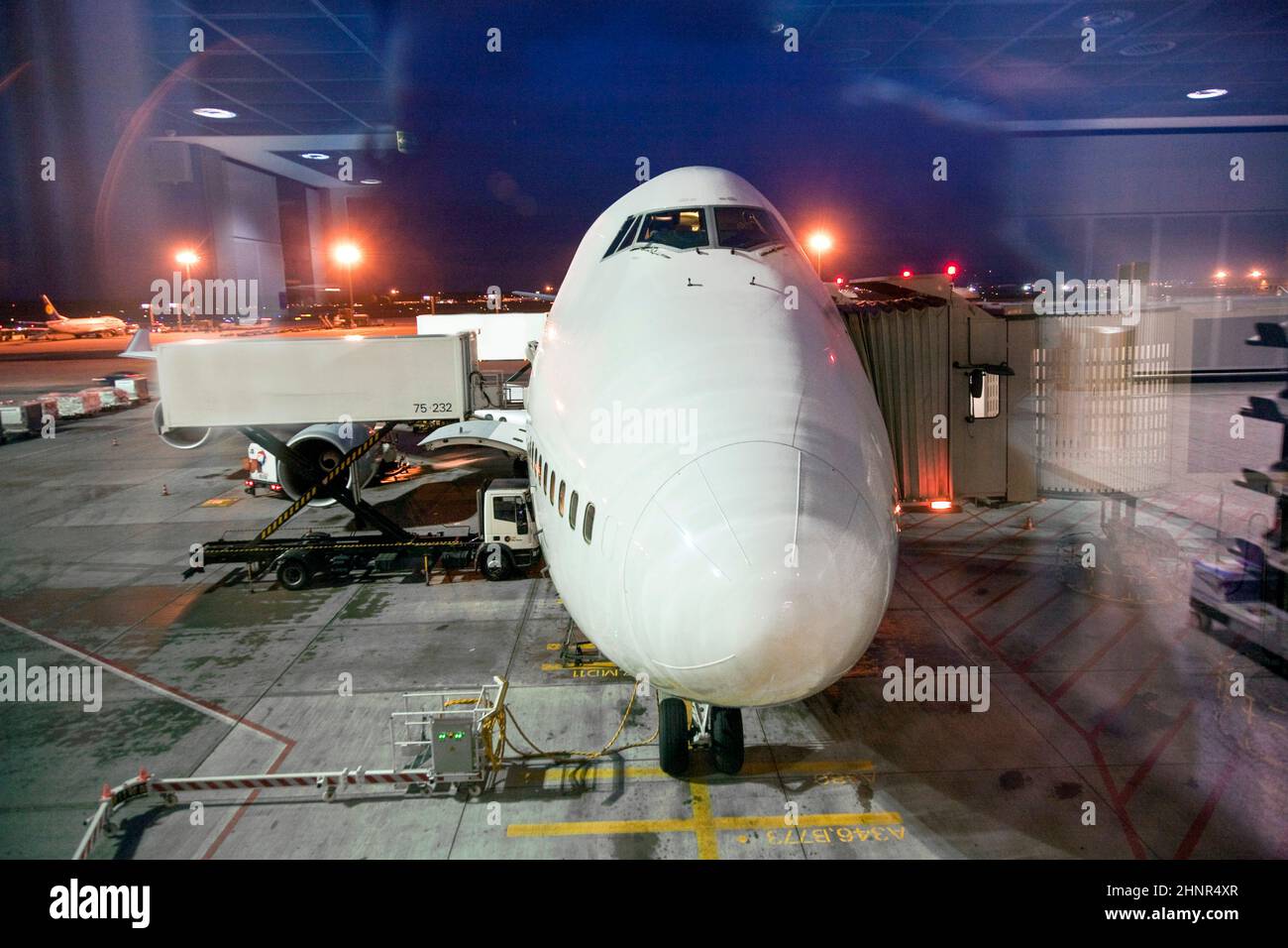aircraft loaded at the gate by night Stock Photo - Alamy