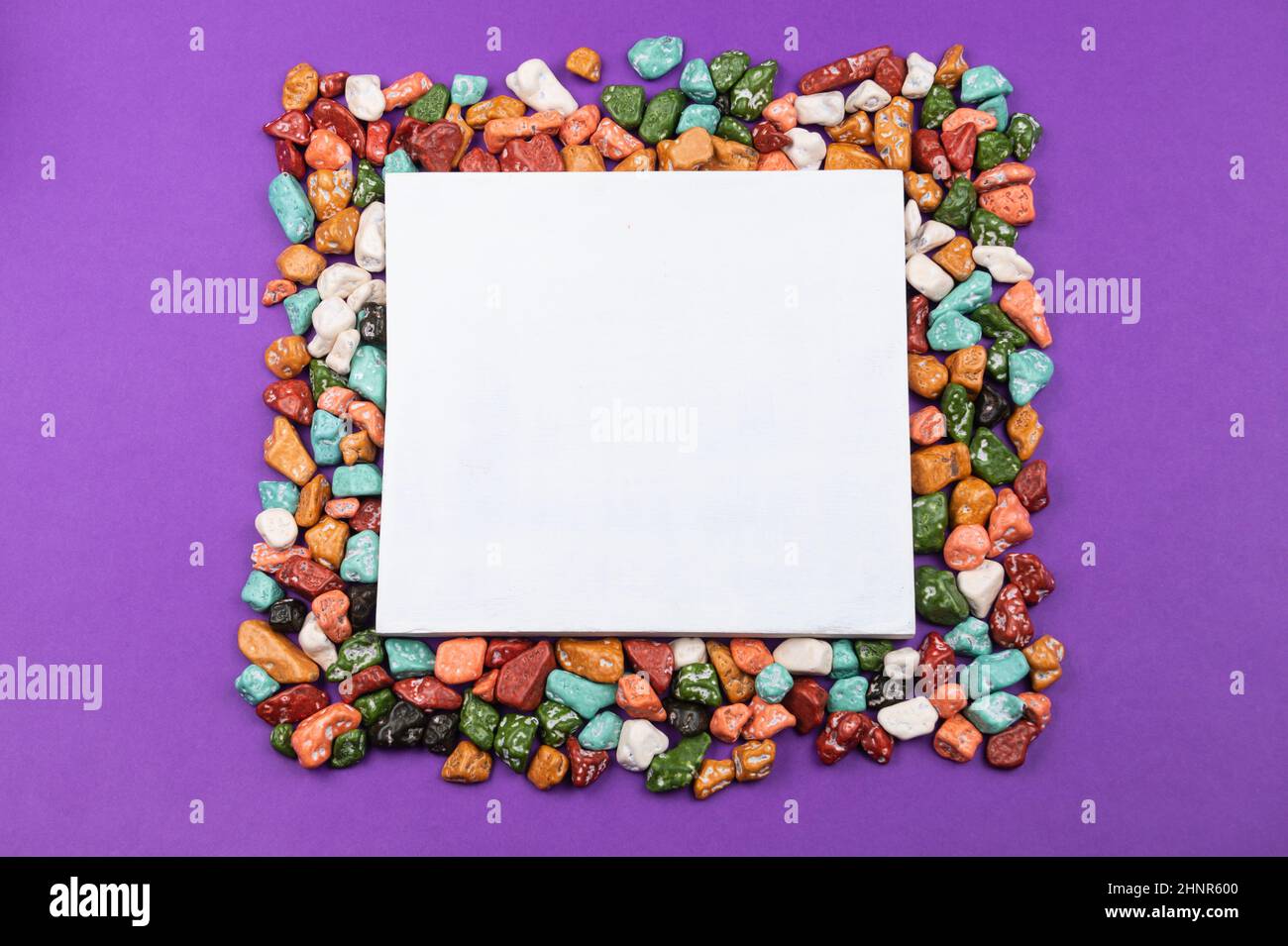 Candy pebbles. sweets in the form of colored stones. frame made from ...