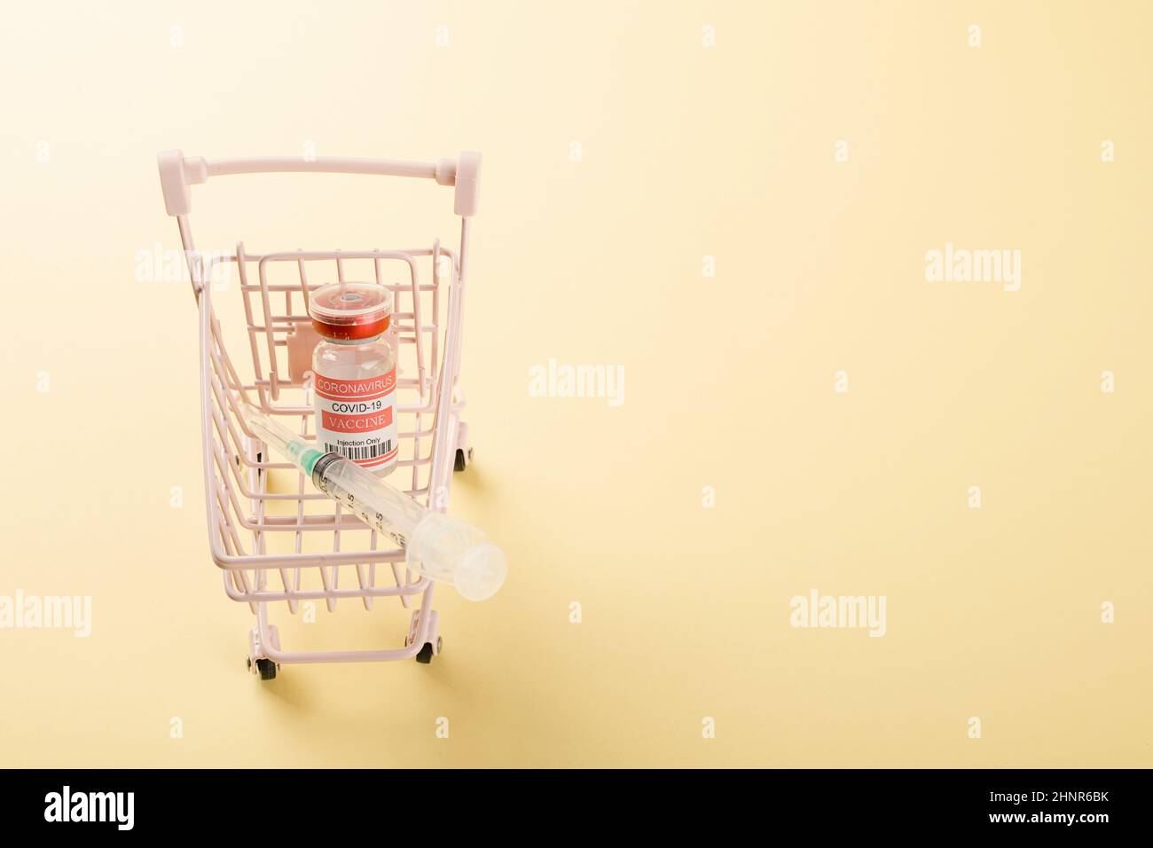 Shopping cart with vaccine vials bottles and syringes for vaccination ...