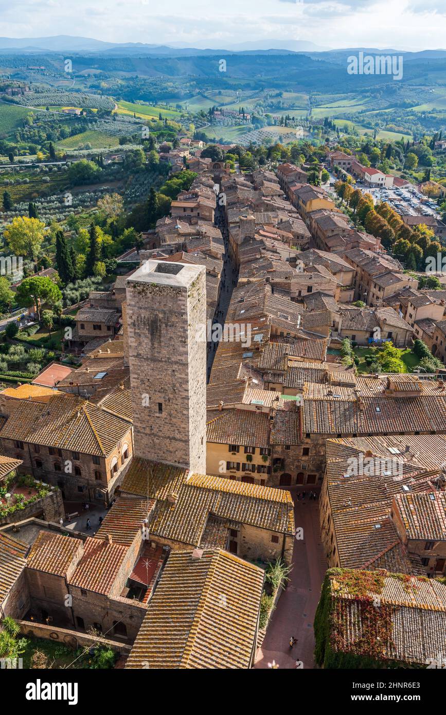 View of the tuscan village of San Gimignano, from the top of Torre Grossa, the highest tower in ...