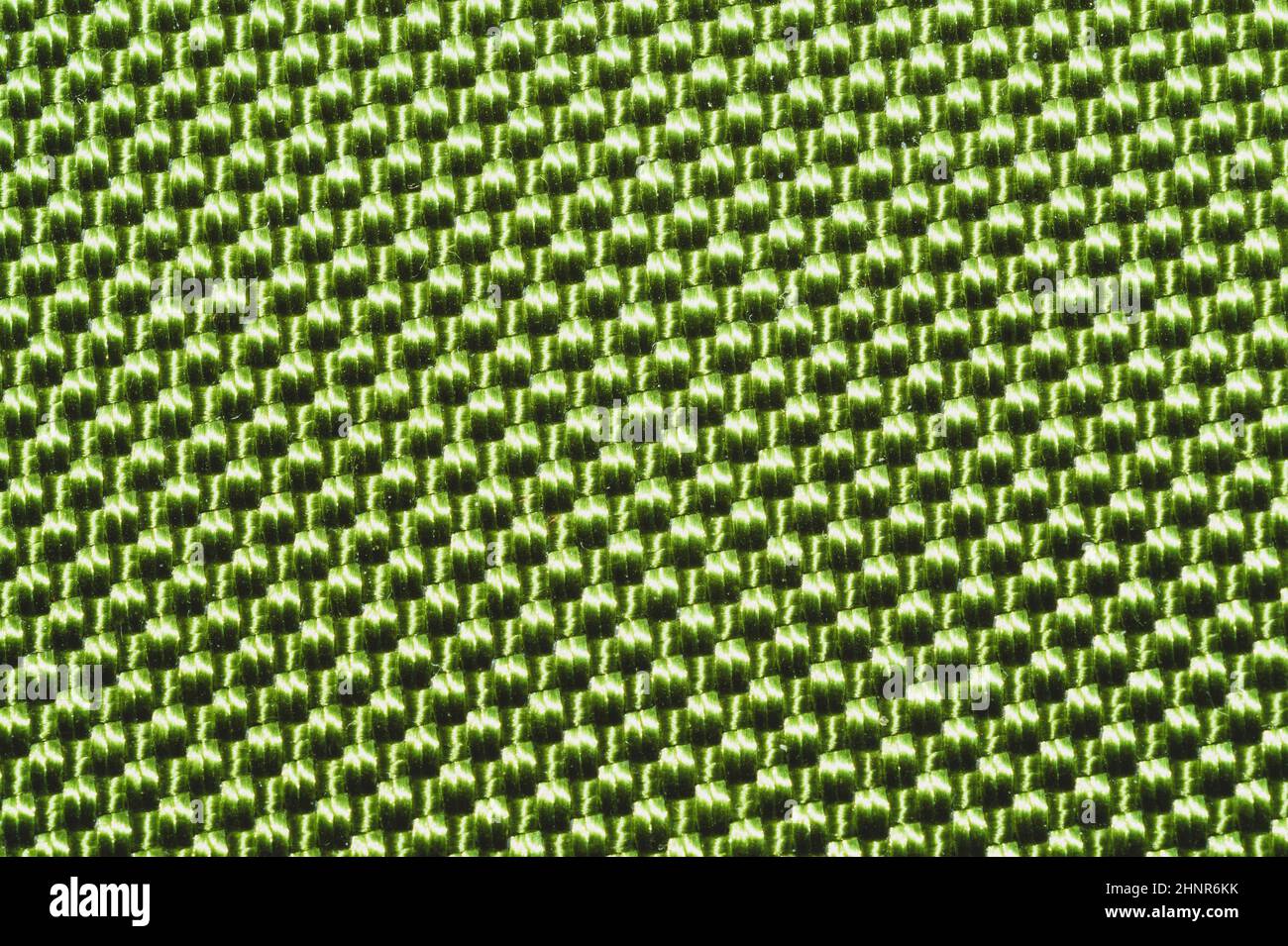 Synthetic fabric texture close up. green braided surface. woven ...