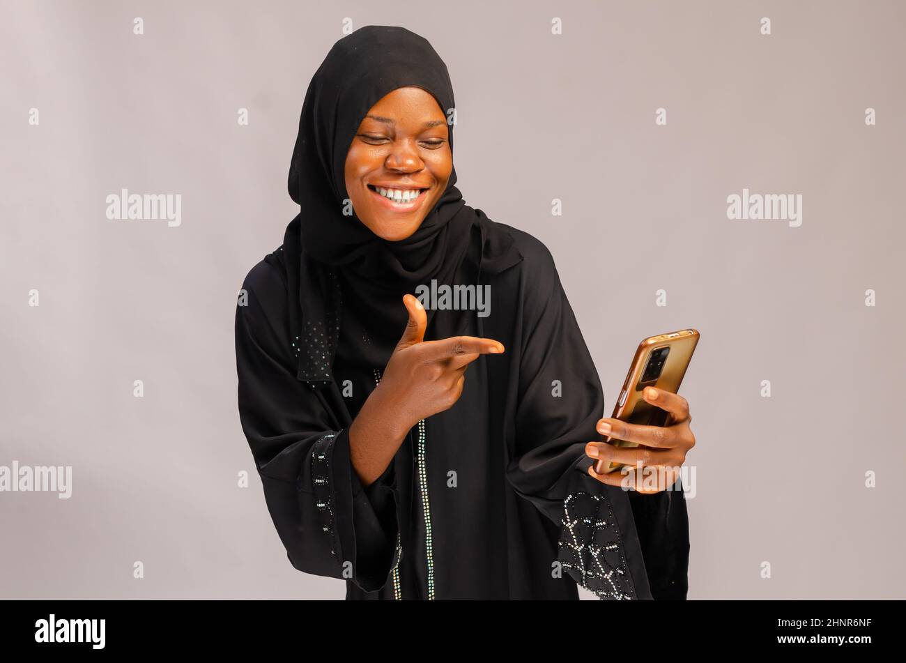 African muslim lady pointing hi-res stock photography and images - Alamy