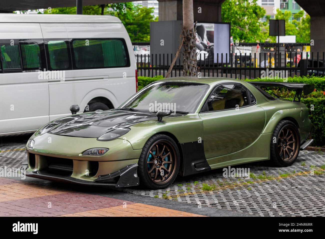 Green tuned sports car parked in Bangkok Thailand Stock Photo - Alamy