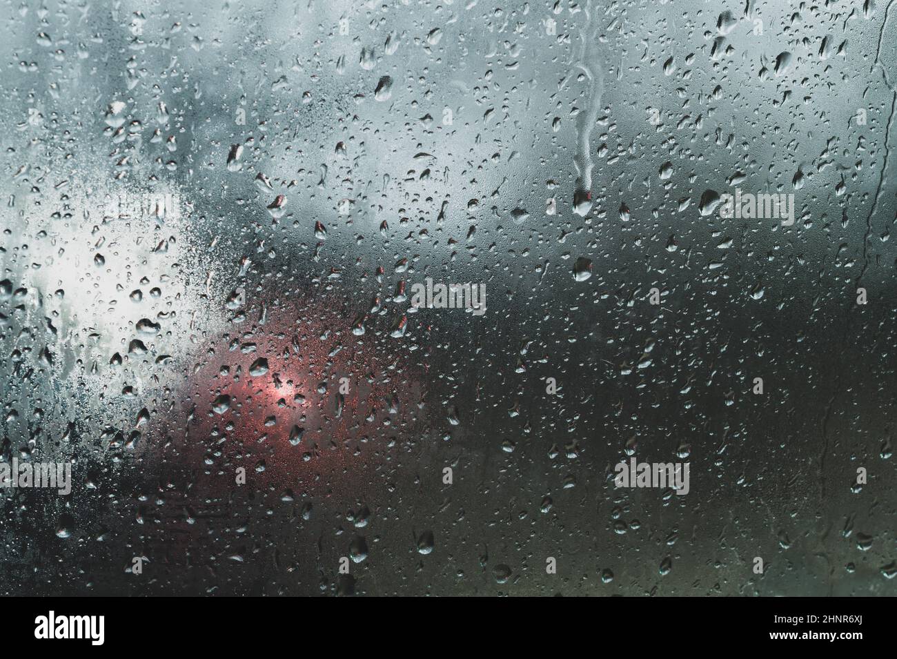 Raindrops on glass window. heavy rain. abstract background with ...